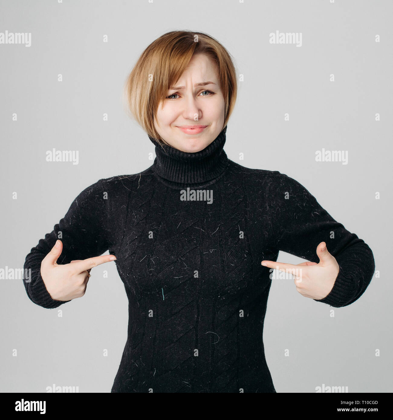 Woman angry holding clothes hi-res stock photography and images - Alamy