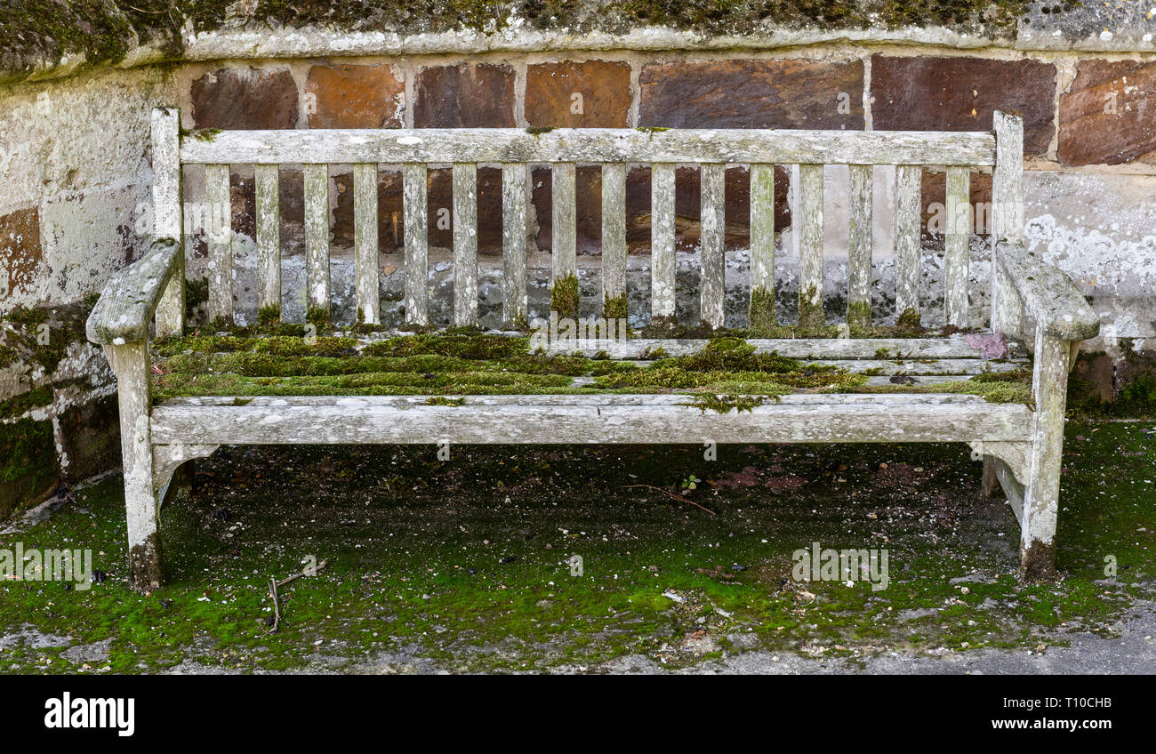 Old wooden bench at the church with moss in Fordingbridge, England ...