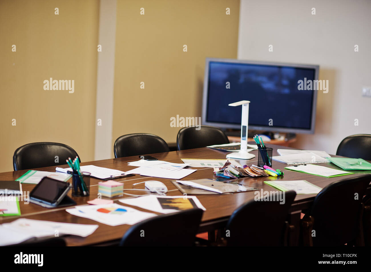 Modern creative workplace with tablet, equipment and table led lamp ...