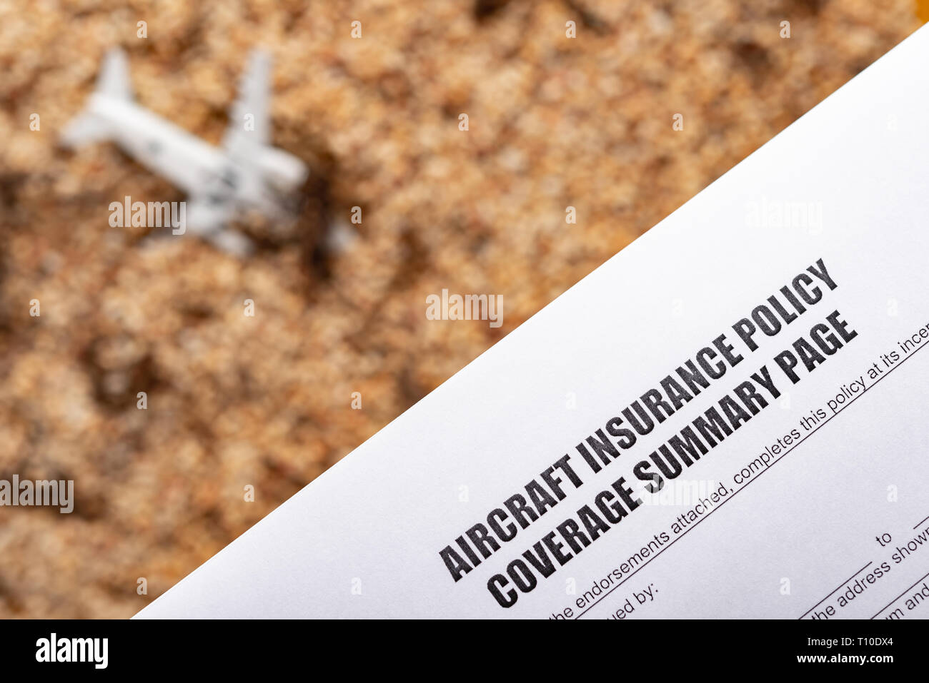 aircraft insurance policy coverage form wtih a blurred crashed aircraft ...