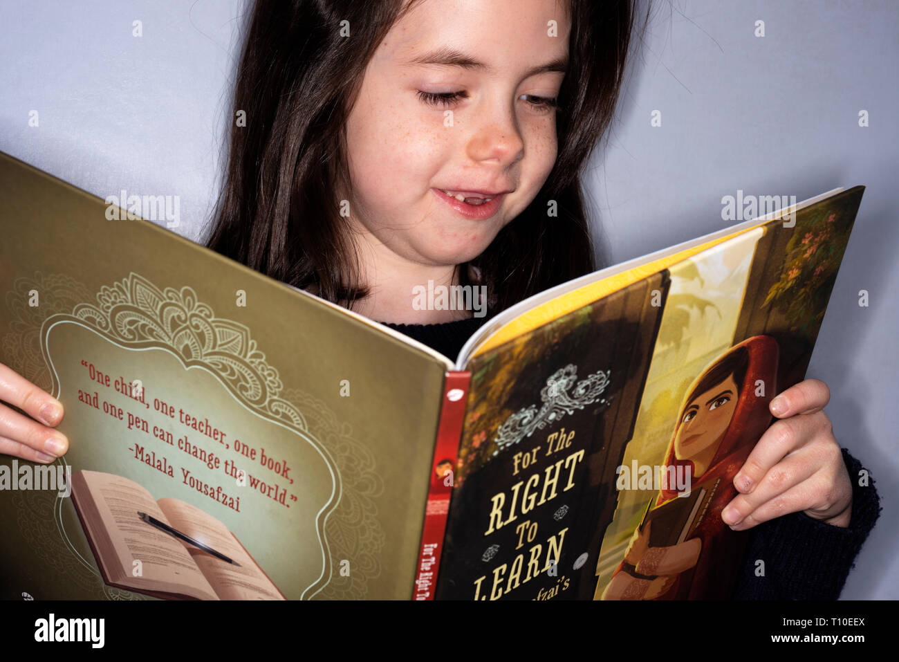 Young girl reading For the right to learn, the story about Malala ...