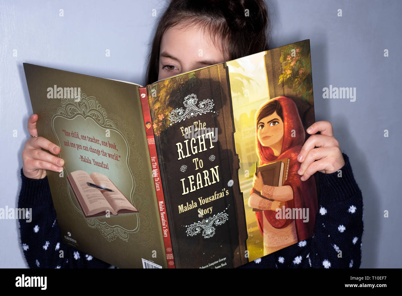 Young girl reading For the right to learn, the story about Malala ...