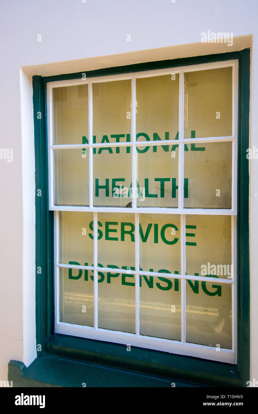 NHS sign in small chemist's window Stock Photo - Alamy
