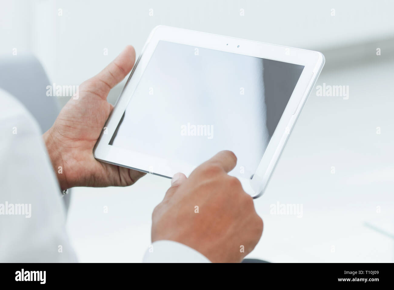 Tapping hands using tablet hi-res stock photography and images - Alamy
