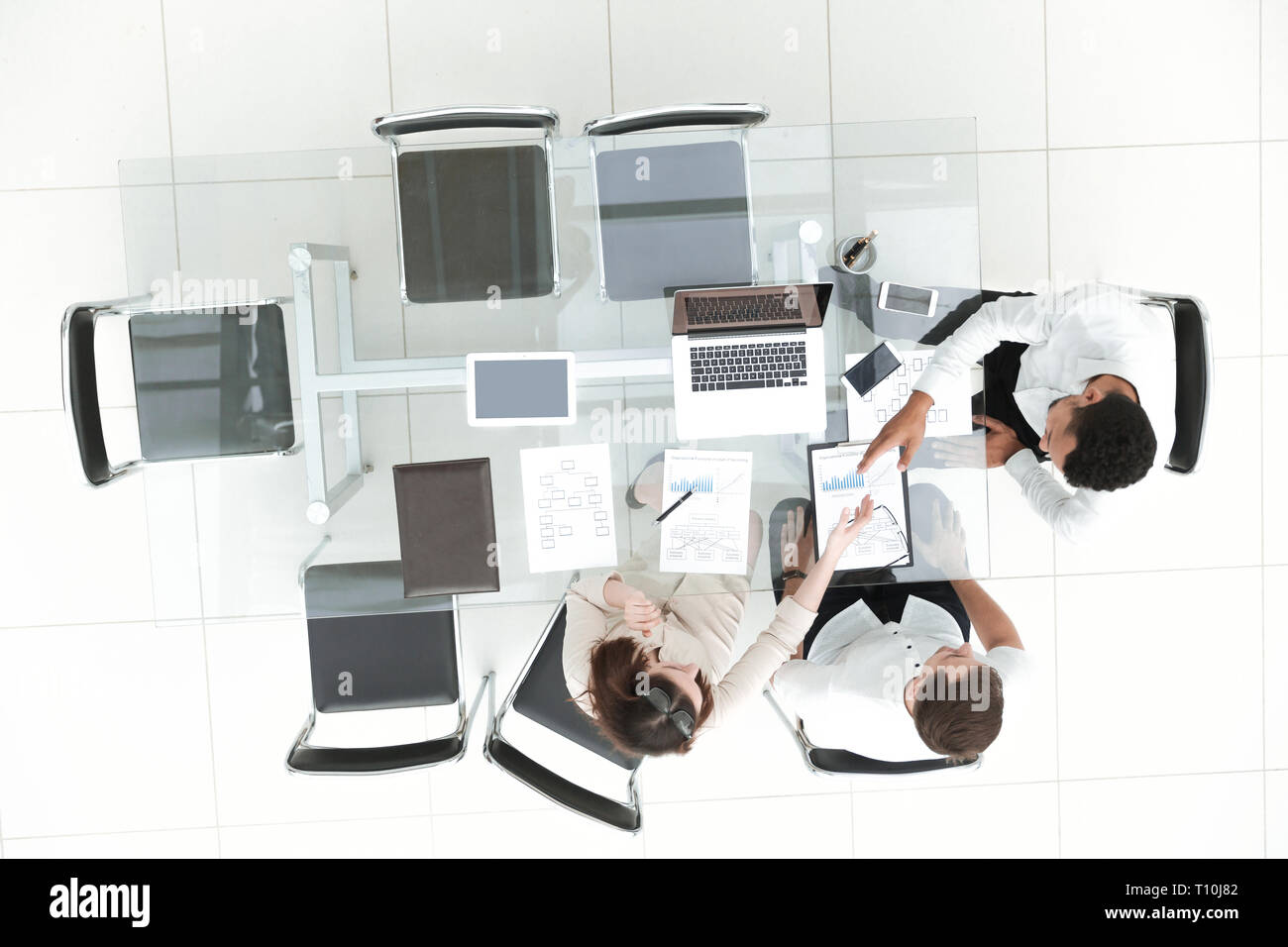 top view. handshake financial partners at the Desk Stock Photo - Alamy