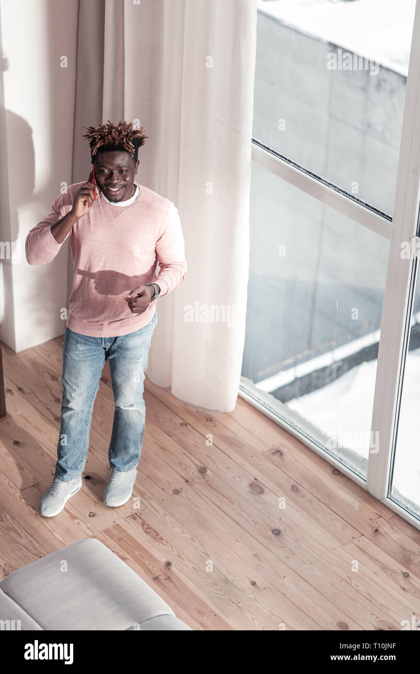 Freelancer man standing window hi-res stock photography and images - Alamy