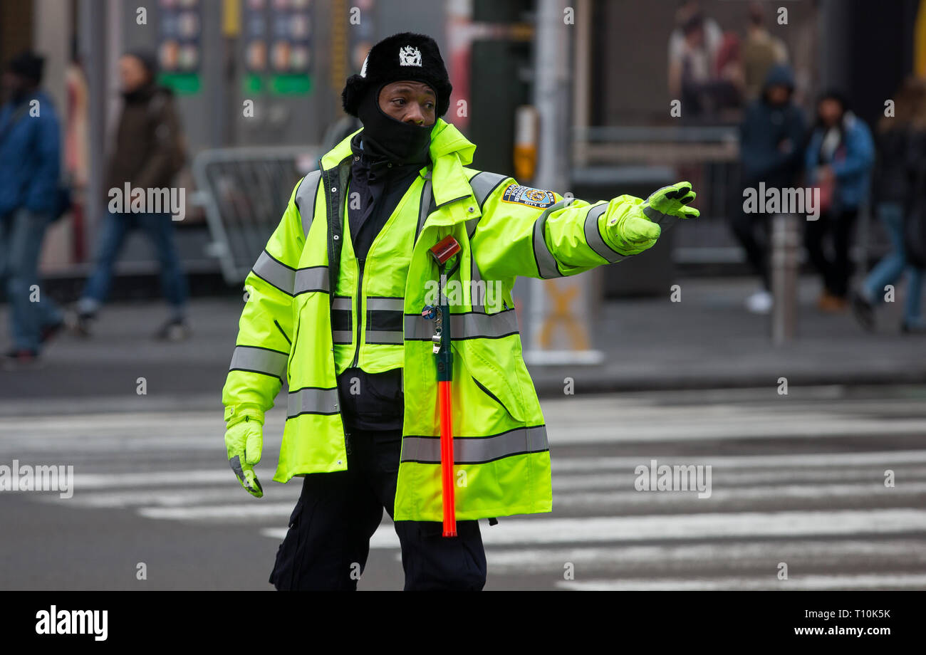 A NYPD Traffic cop directs cars in Times Square, New York City, NY, USA ...
