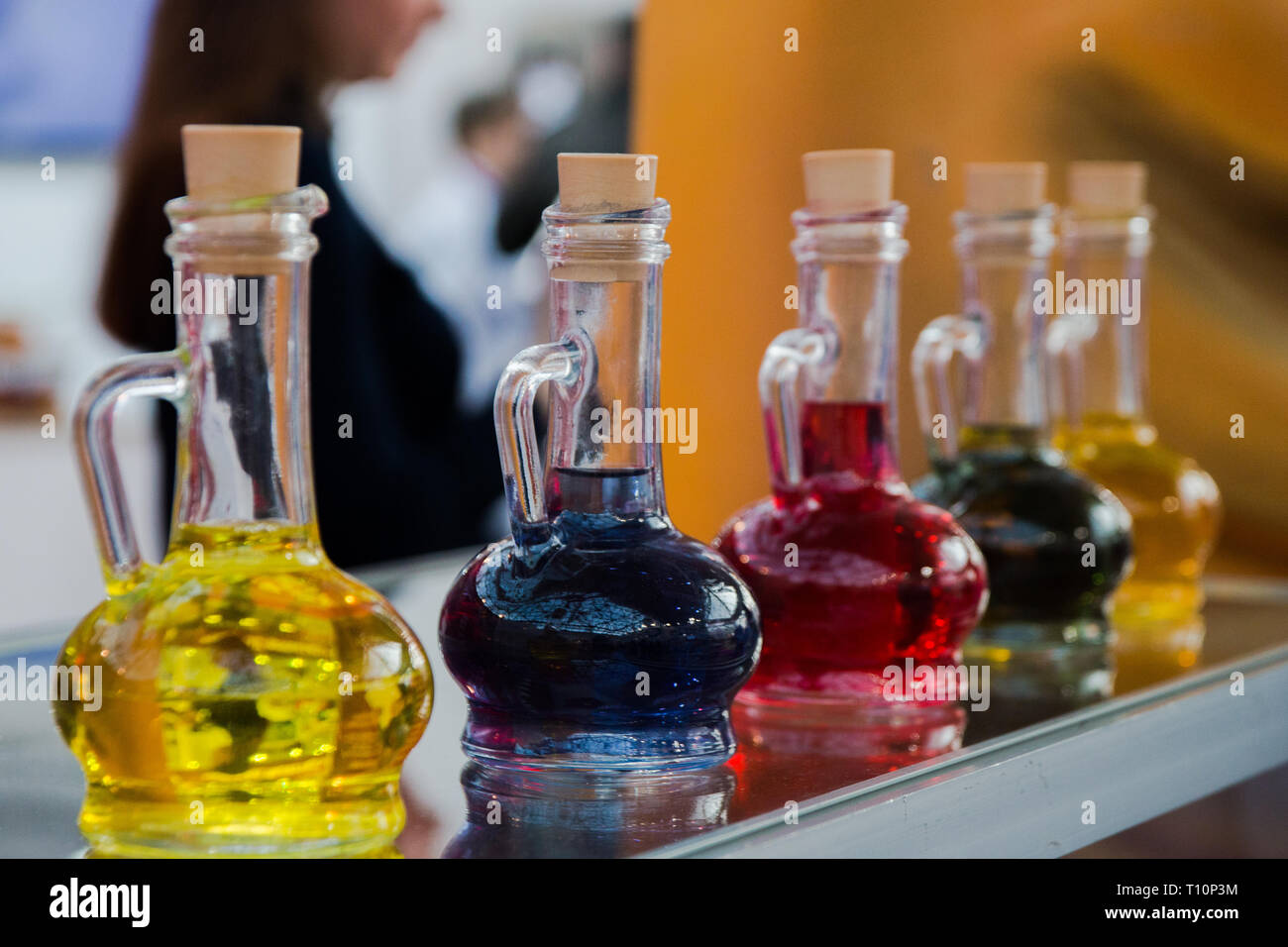 five bottles of different color food coloring on the shop window ...