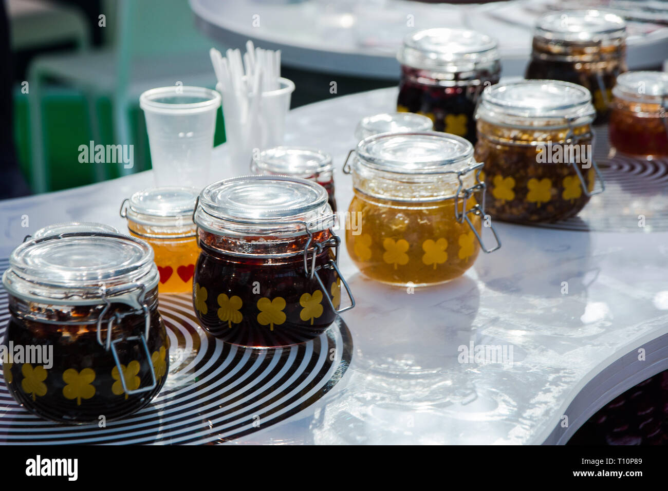 glass jars of jam and jelly for tasting on display Stock Photo - Alamy