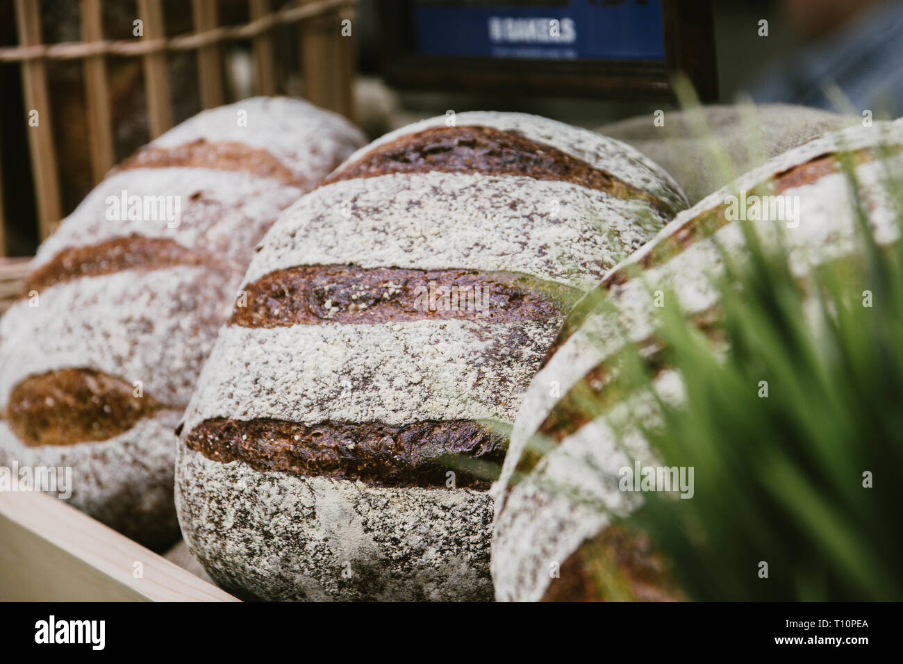 different fresh bread on the shelves in bakery Stock Photo - Alamy