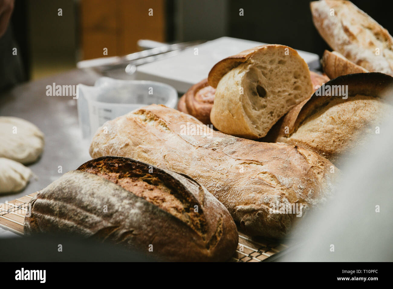 different fresh bread on the shelves in bakery. Selective focus Stock ...
