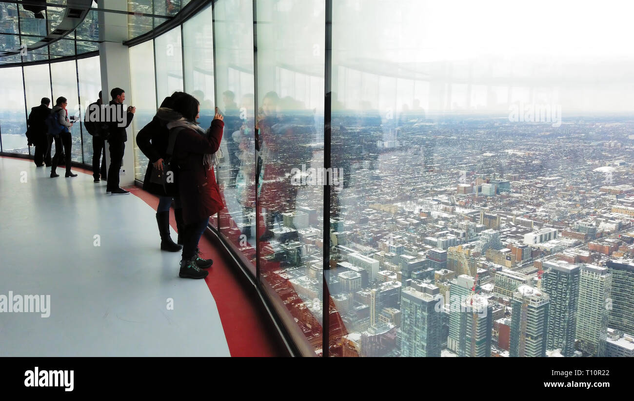 Tourists enjoy the view over Toronto from the CN Tower Stock Photo - Alamy