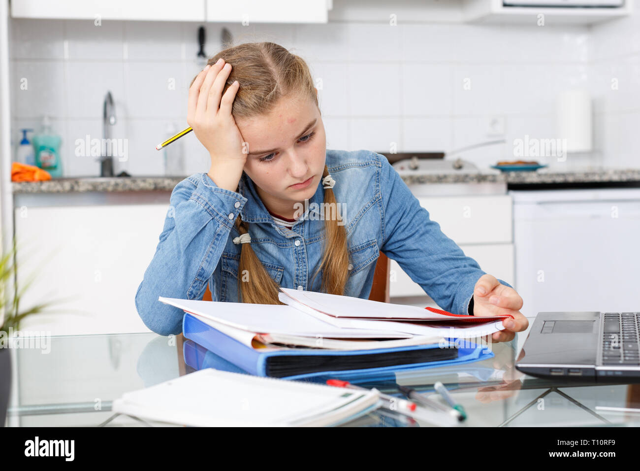 Portrait of teenage girl with sad face expression because she is tired ...