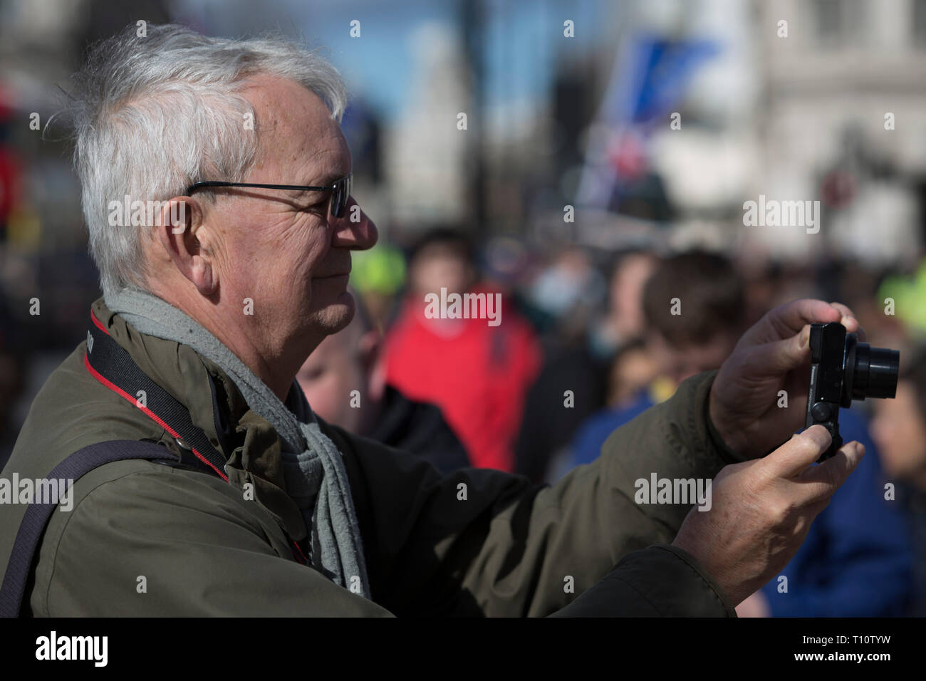 The Magnum photographer Martin Parr takes a photo for some tourists ...