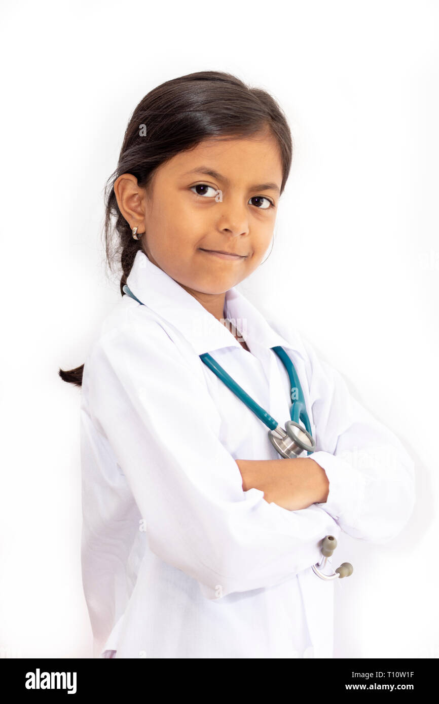Cute little girl, playing doctor, posing with white coat Stock Photo ...
