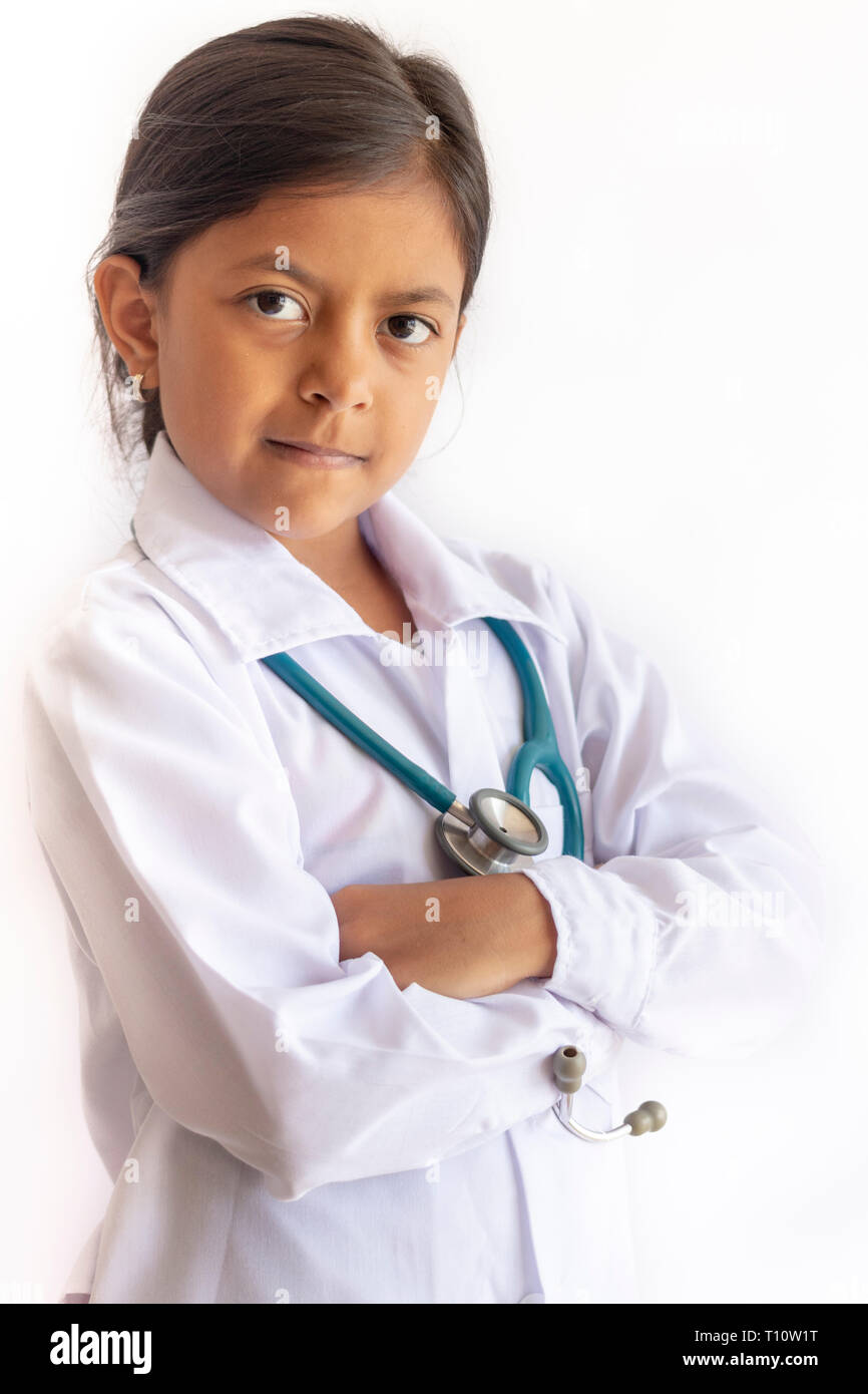 Cute little girl, playing doctor, posing with white coat Stock Photo ...