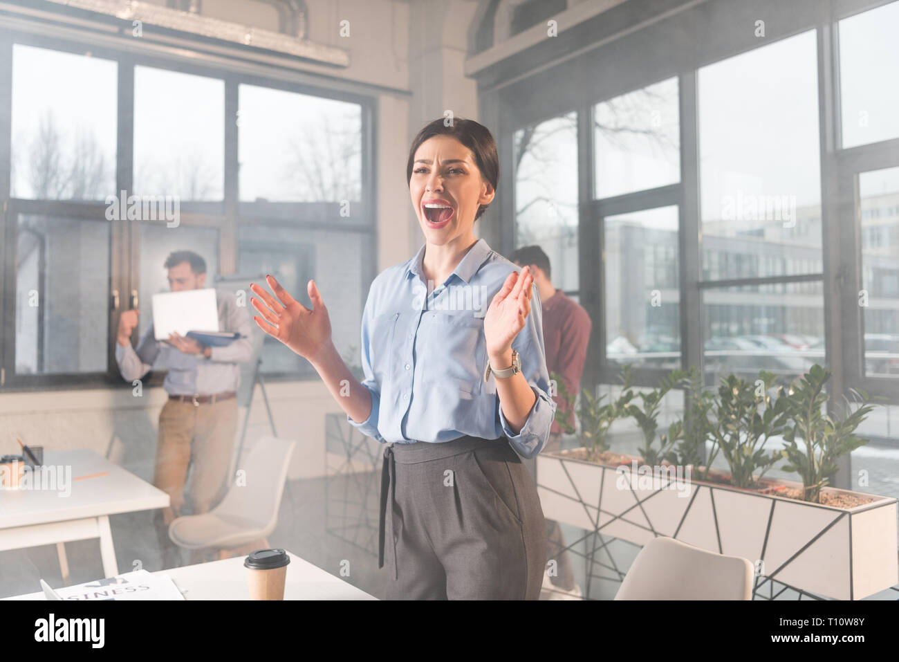 Screaming businesswoman standing hi-res stock photography and images ...