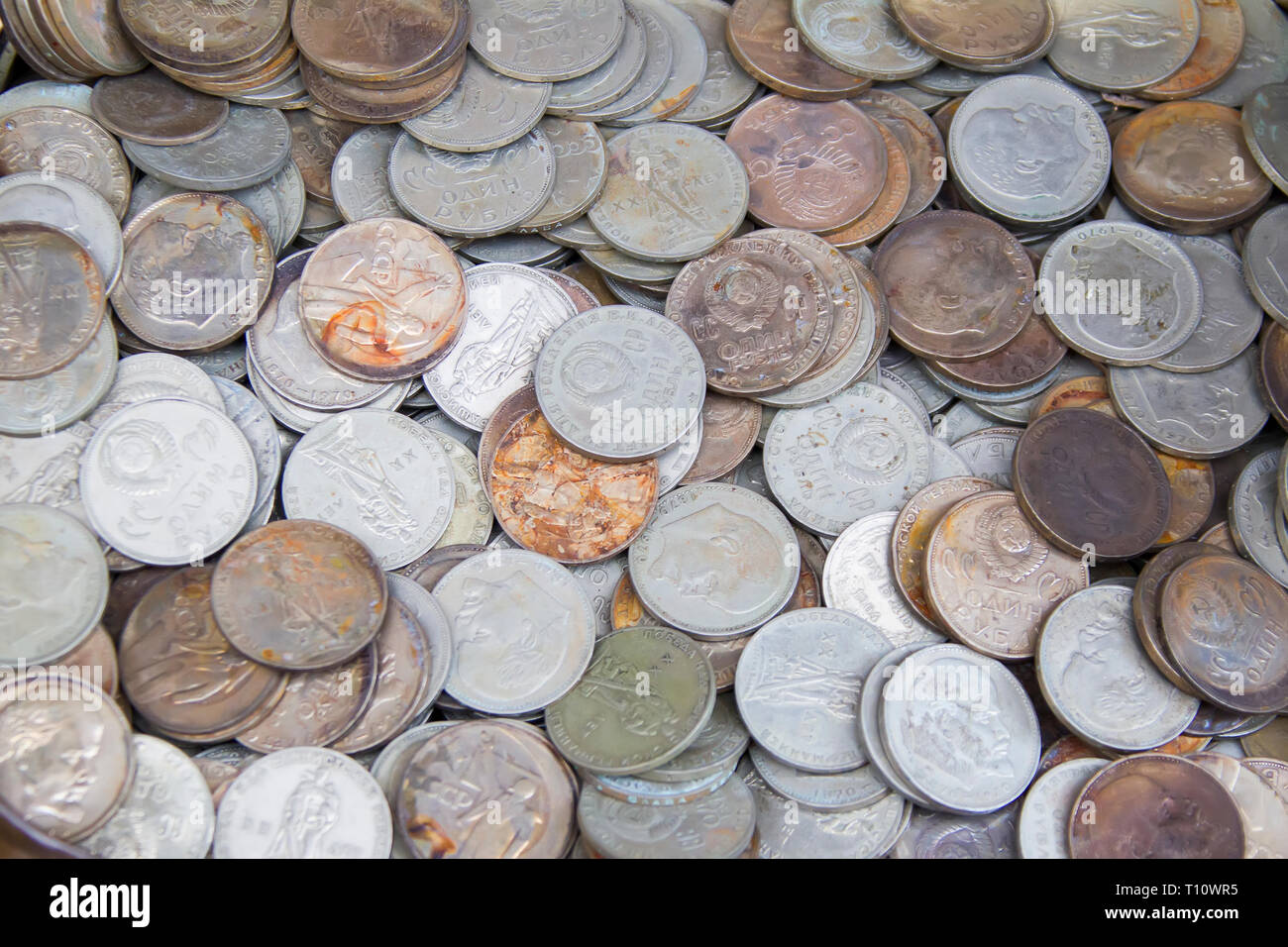 Soviet coins sprinkled on the whole frame of the photo. The USSR ruble ...