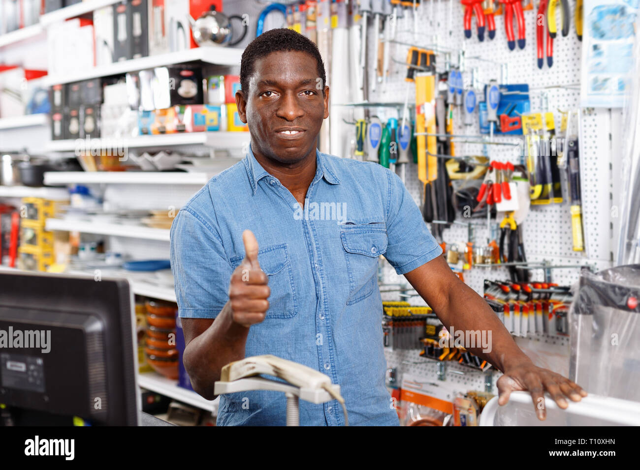 Portrait of smiling happy successful owner of household goods store ...