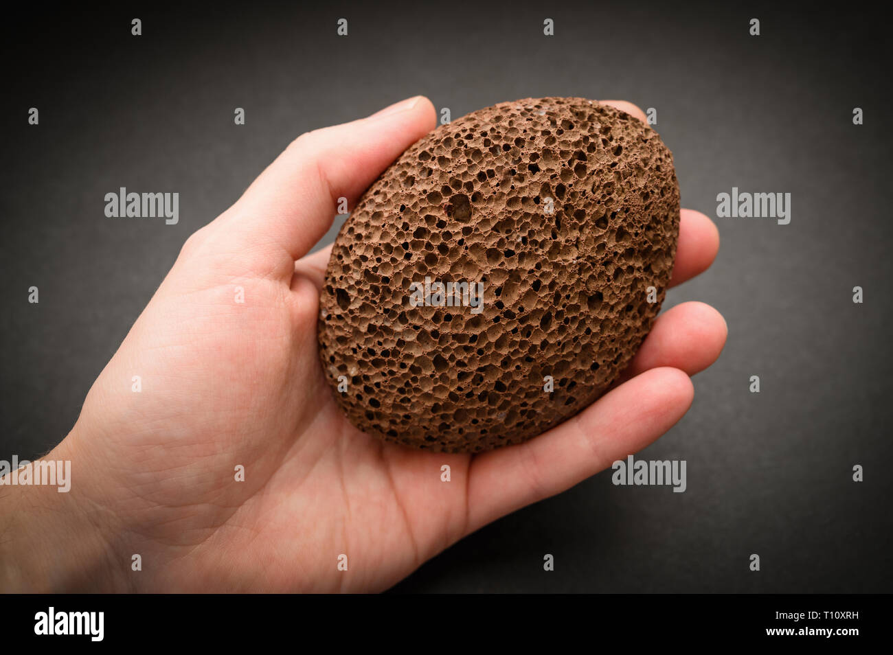 Pumice stone for spa in a hand Stock Photo - Alamy