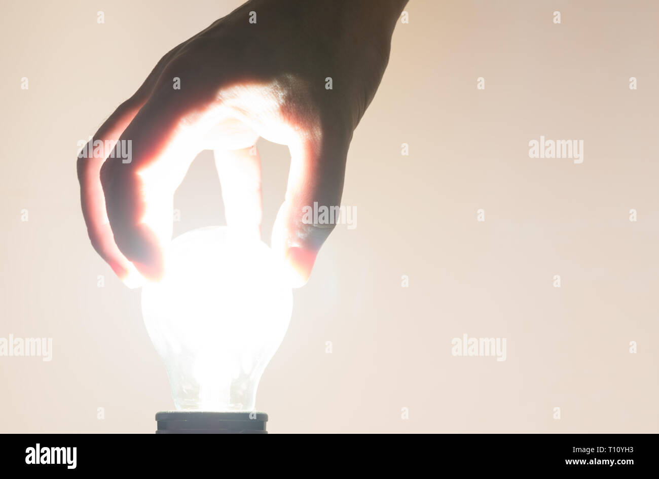 Hand installing led light bulb hi-res stock photography and images - Alamy