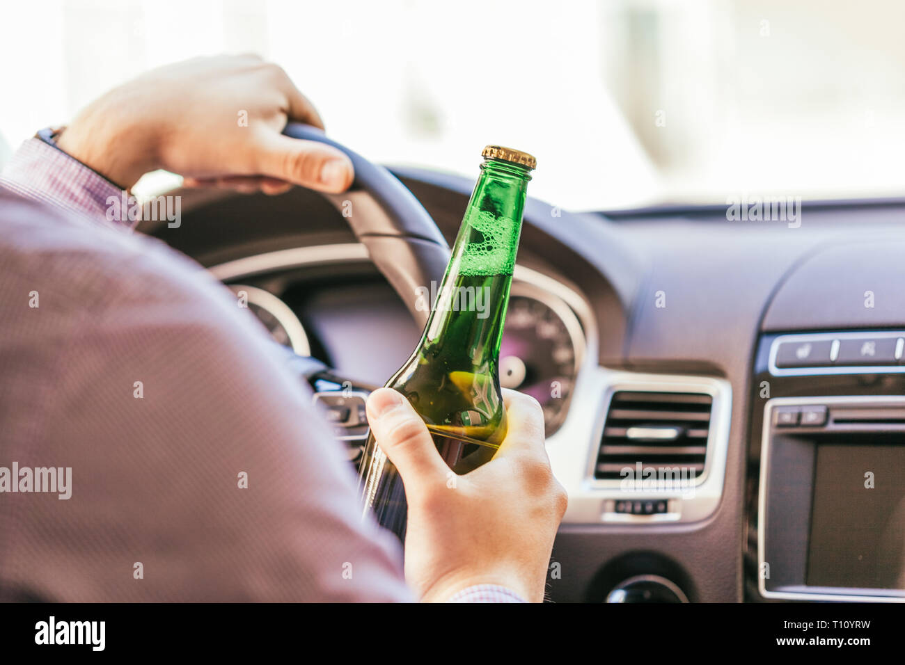 man drinking alcohol while driving the car Stock Photo - Alamy