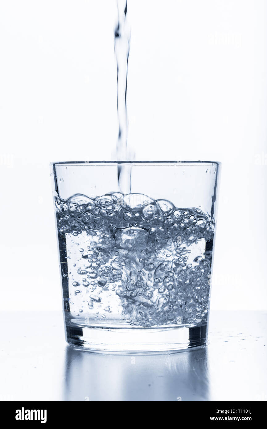 water splashing from glass isolated on white background Stock Photo - Alamy