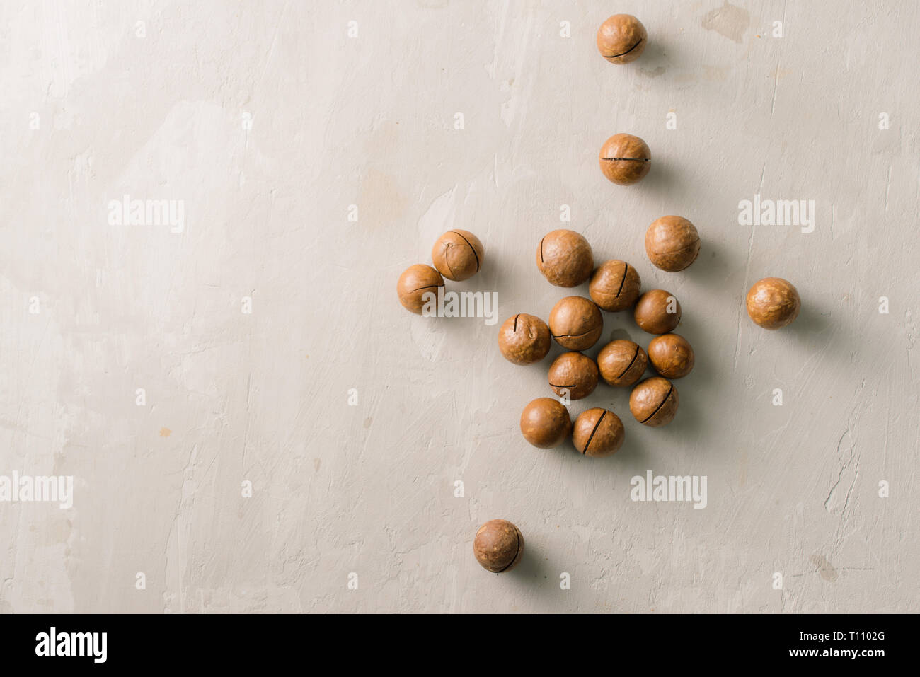 Superfood. Organic macadamia nut on stone background Stock Photo - Alamy