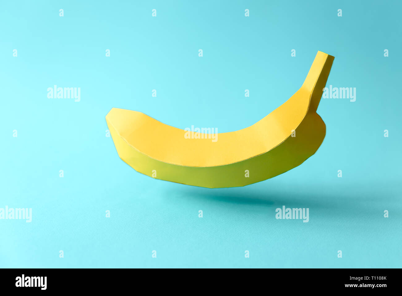 Paper banana on blue pastel background. Creative idea. Art food concept ...