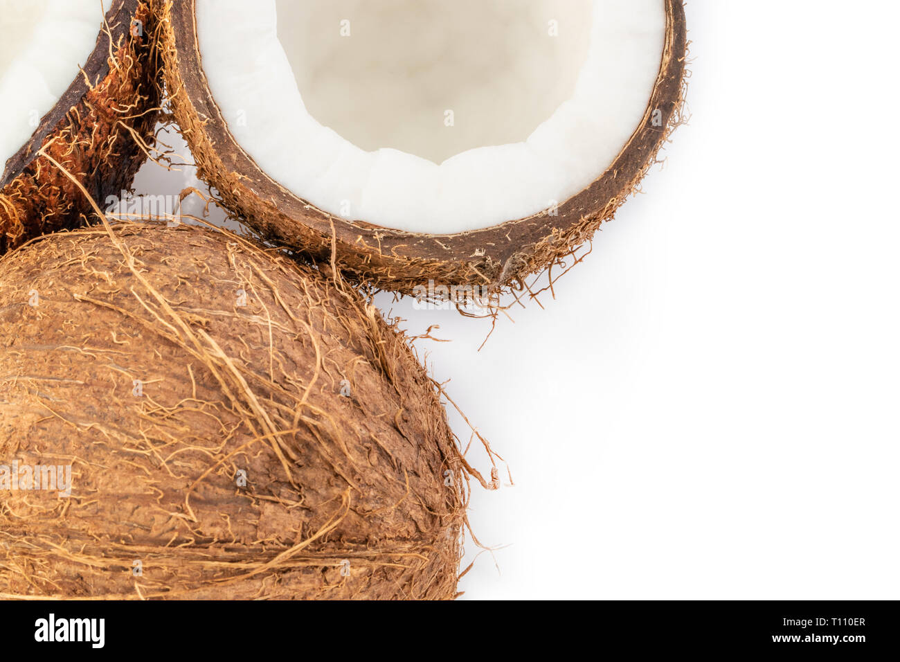 Coconut pieces top view isolated on white background Stock Photo - Alamy