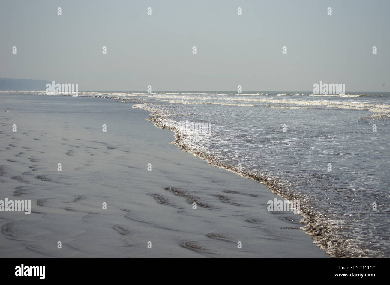 Clean water waves on beach Stock Photo - Alamy