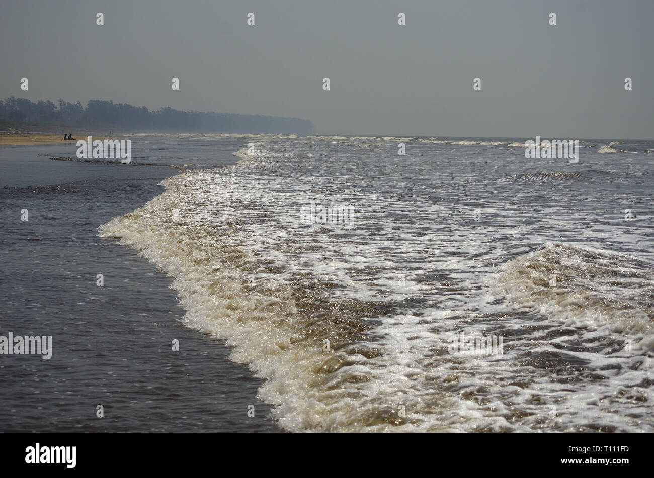Clean water waves on beach Stock Photo - Alamy