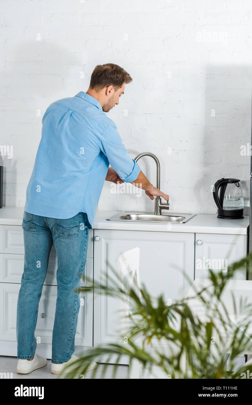 Man Washing Clothes By Hand