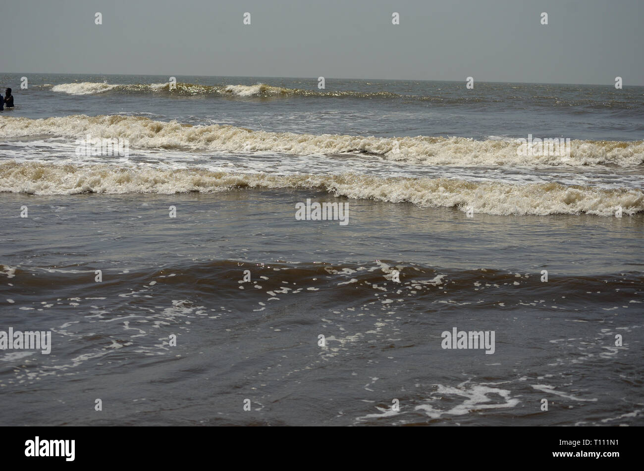 Clean water waves on beach Stock Photo - Alamy