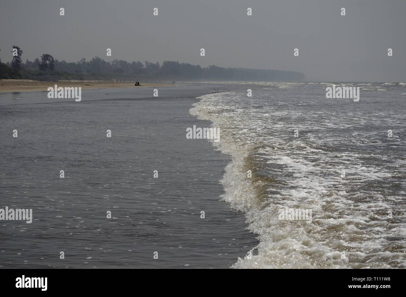 Clean water waves on beach Stock Photo - Alamy