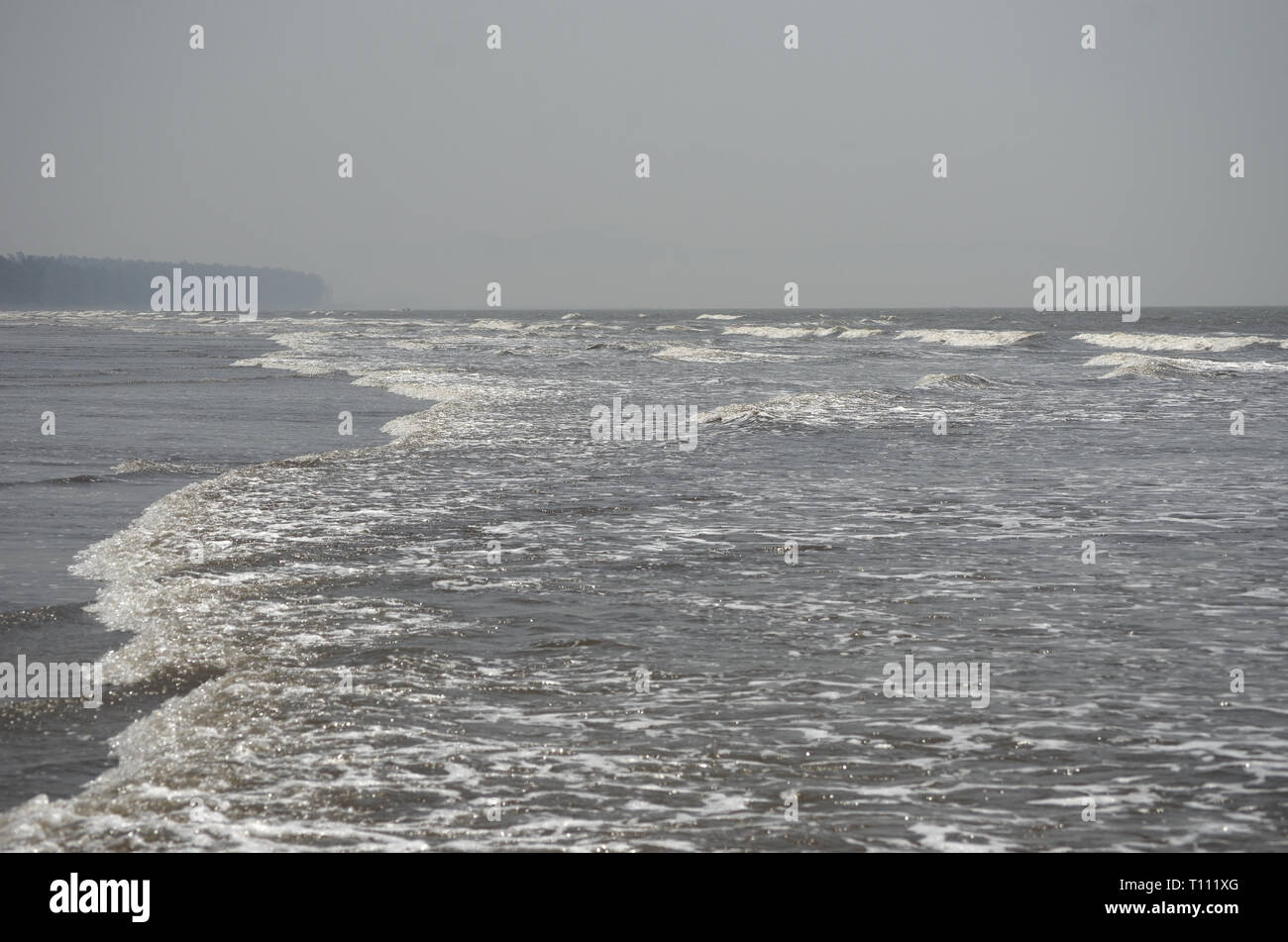 Clean water waves on beach Stock Photo - Alamy