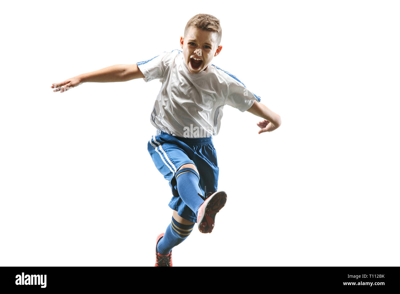 Young boy running and jumping isolated on white studio background ...