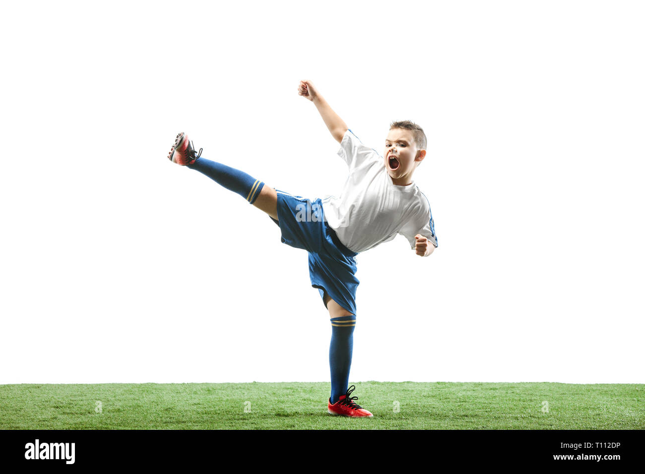 Young boy running and jumping isolated on white studio background ...