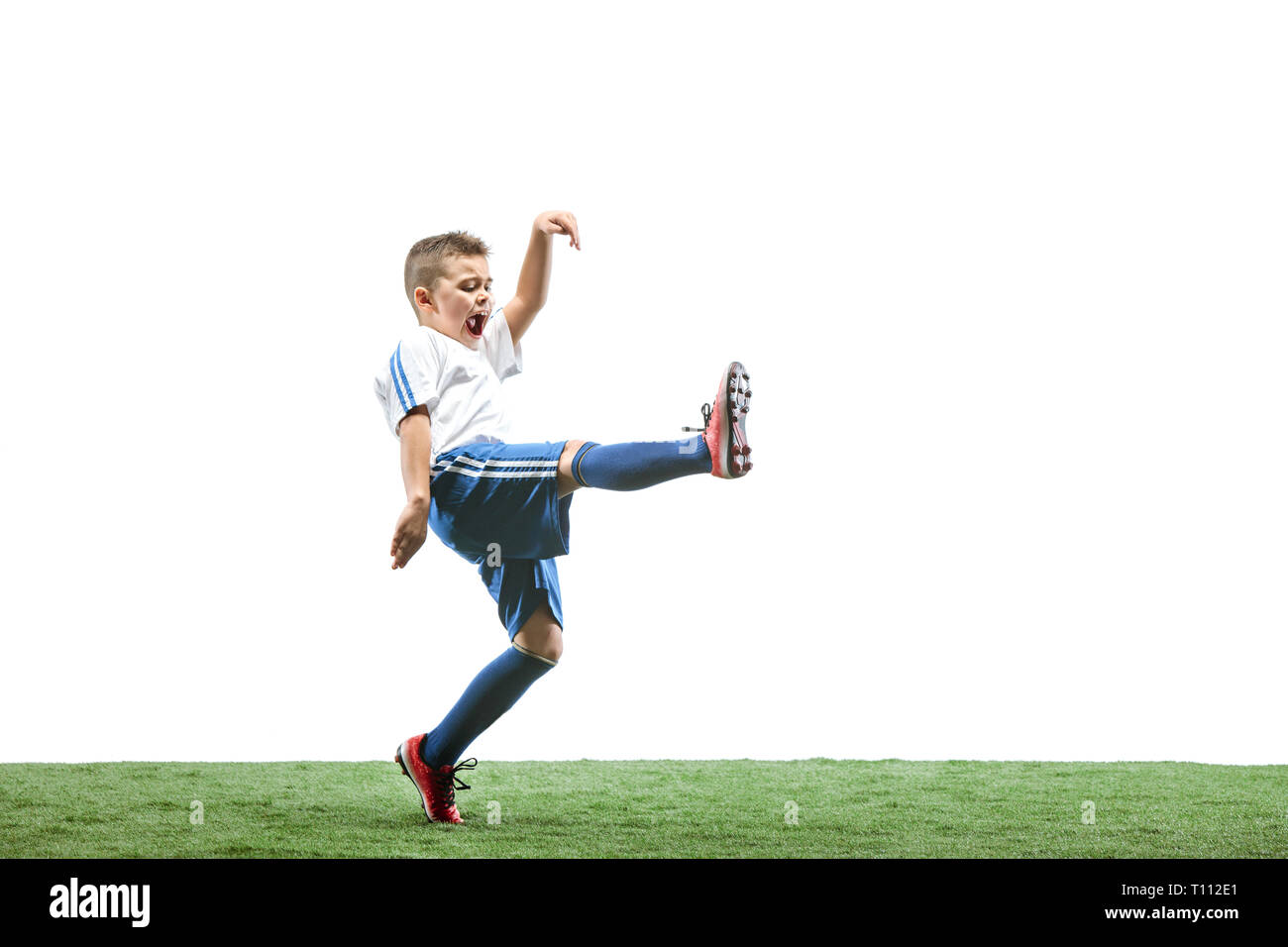 Young boy running and jumping isolated on white studio background ...