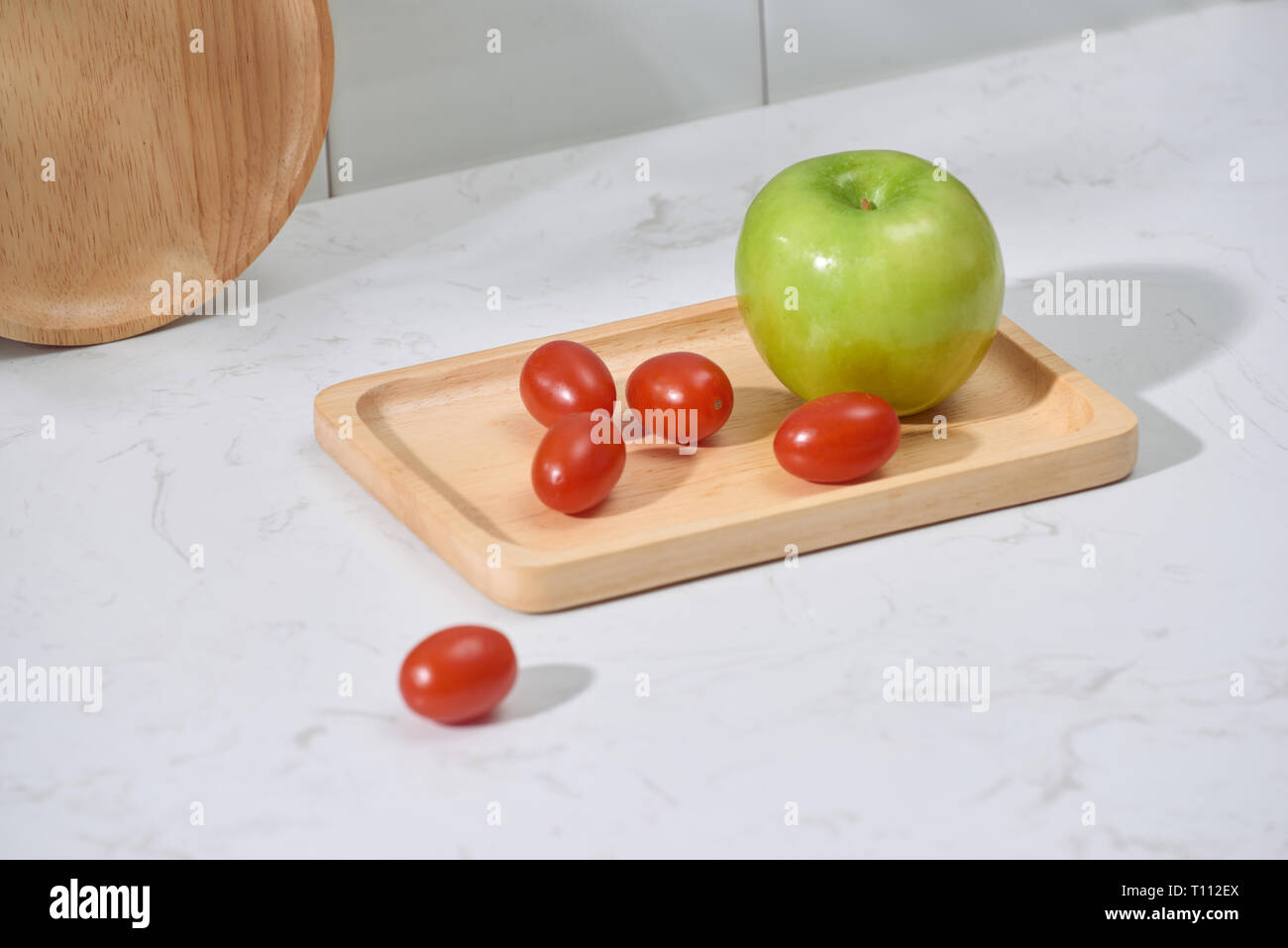 Kitchen utensils with fresh vegetable and fruit on the table. Kitchen ...