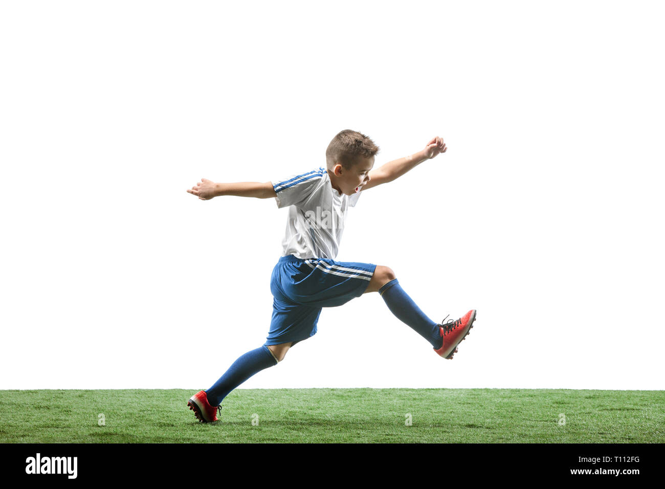 Young boy running and jumping isolated on white studio background ...