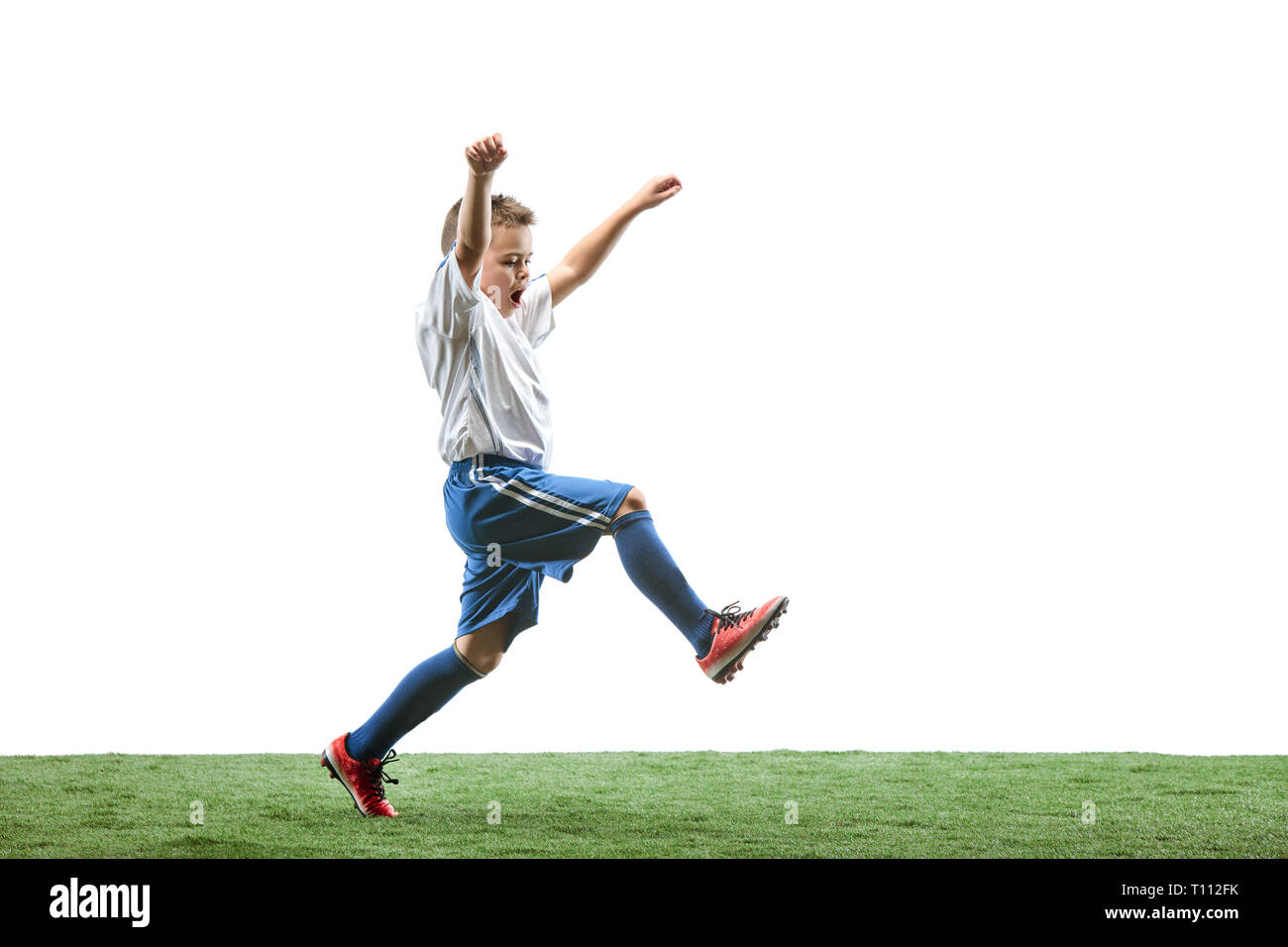 Young boy running and jumping isolated on white studio background ...