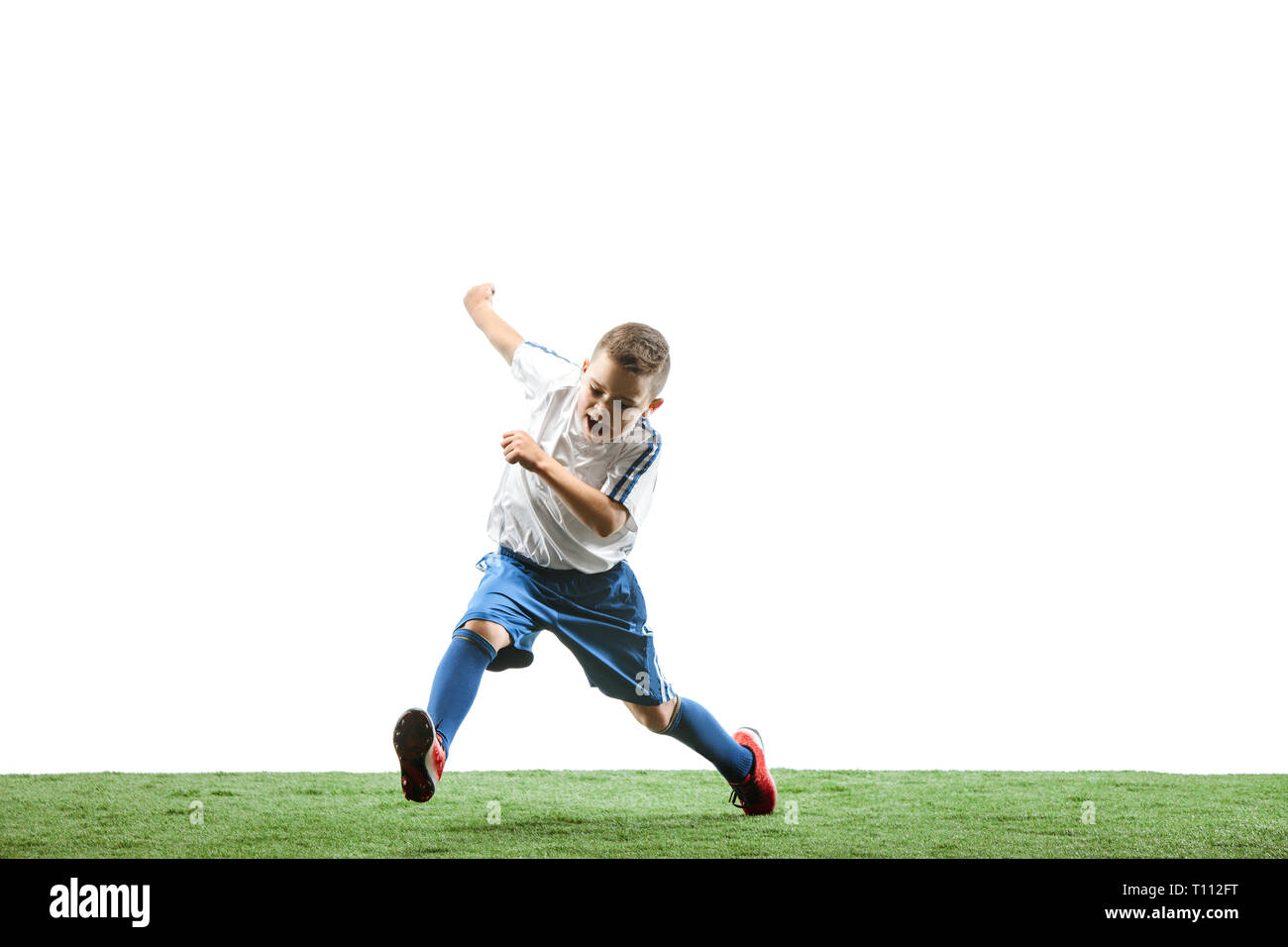 Young boy running and jumping isolated on white studio background ...