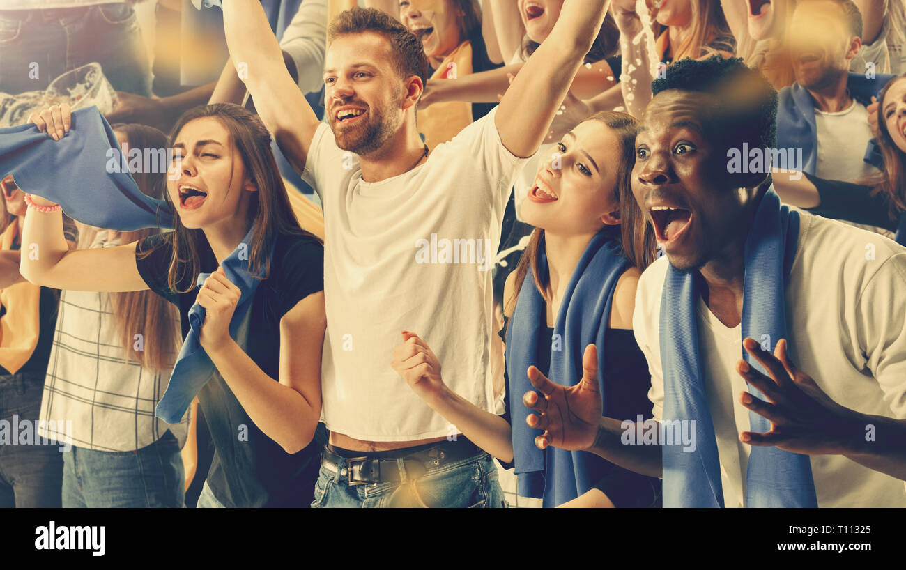 Group of happy fans are cheering for their team victory Stock Photo - Alamy