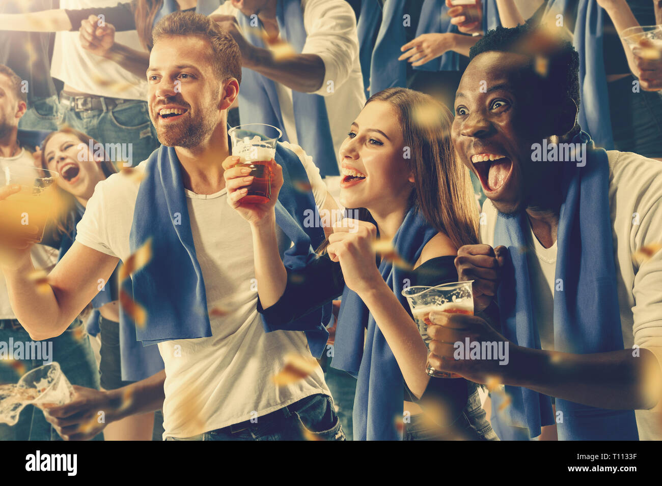 Group of happy fans are cheering for their team victory Stock Photo - Alamy