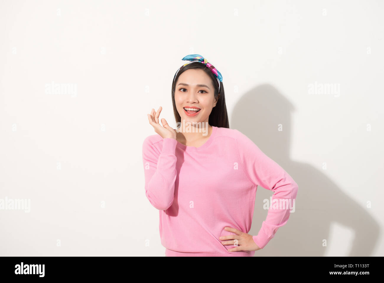 Asian woman touching her face with joy, nice smile, happy and bright ...