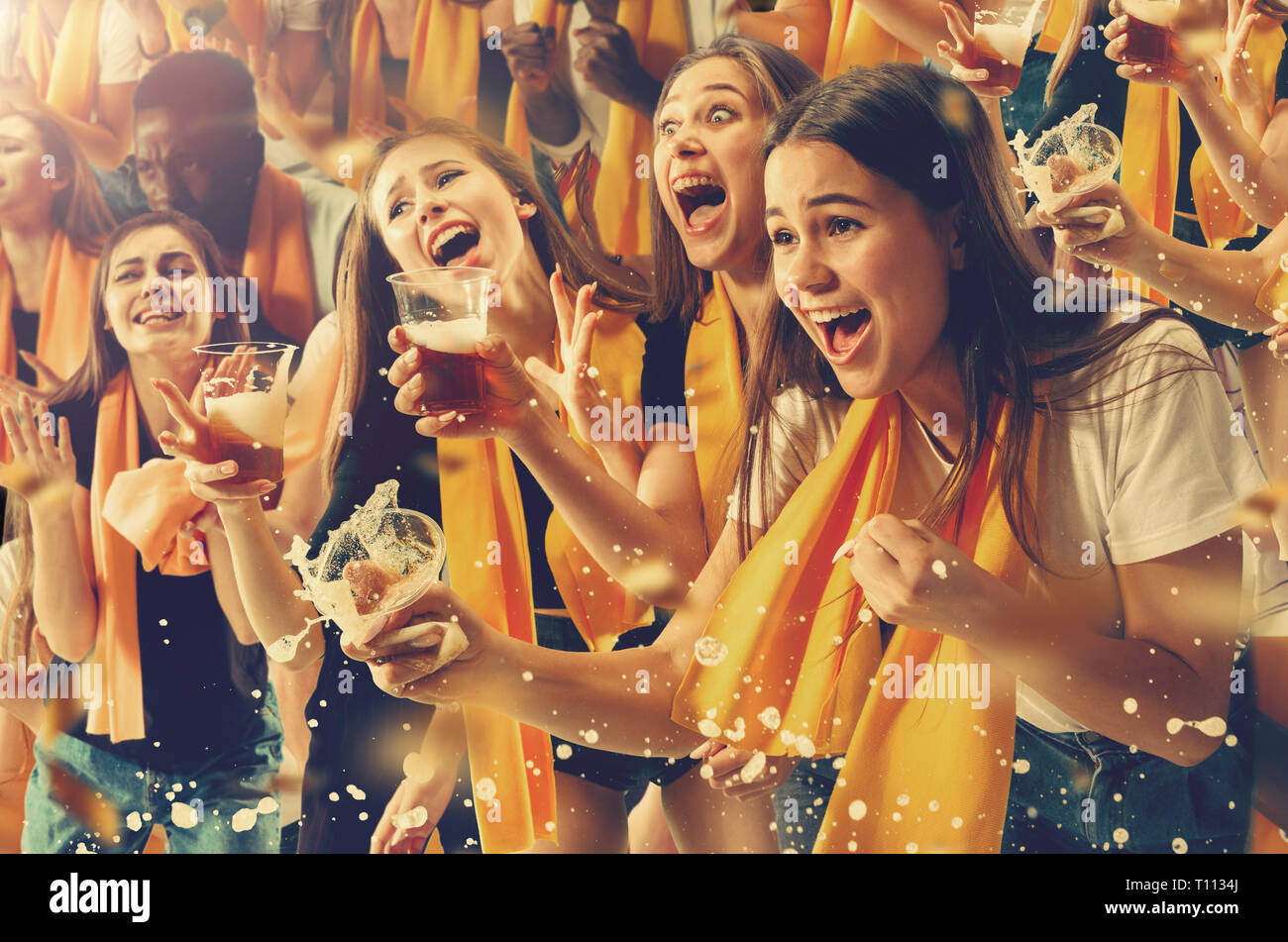 Group of happy fans are cheering for their team victory. Collage made ...