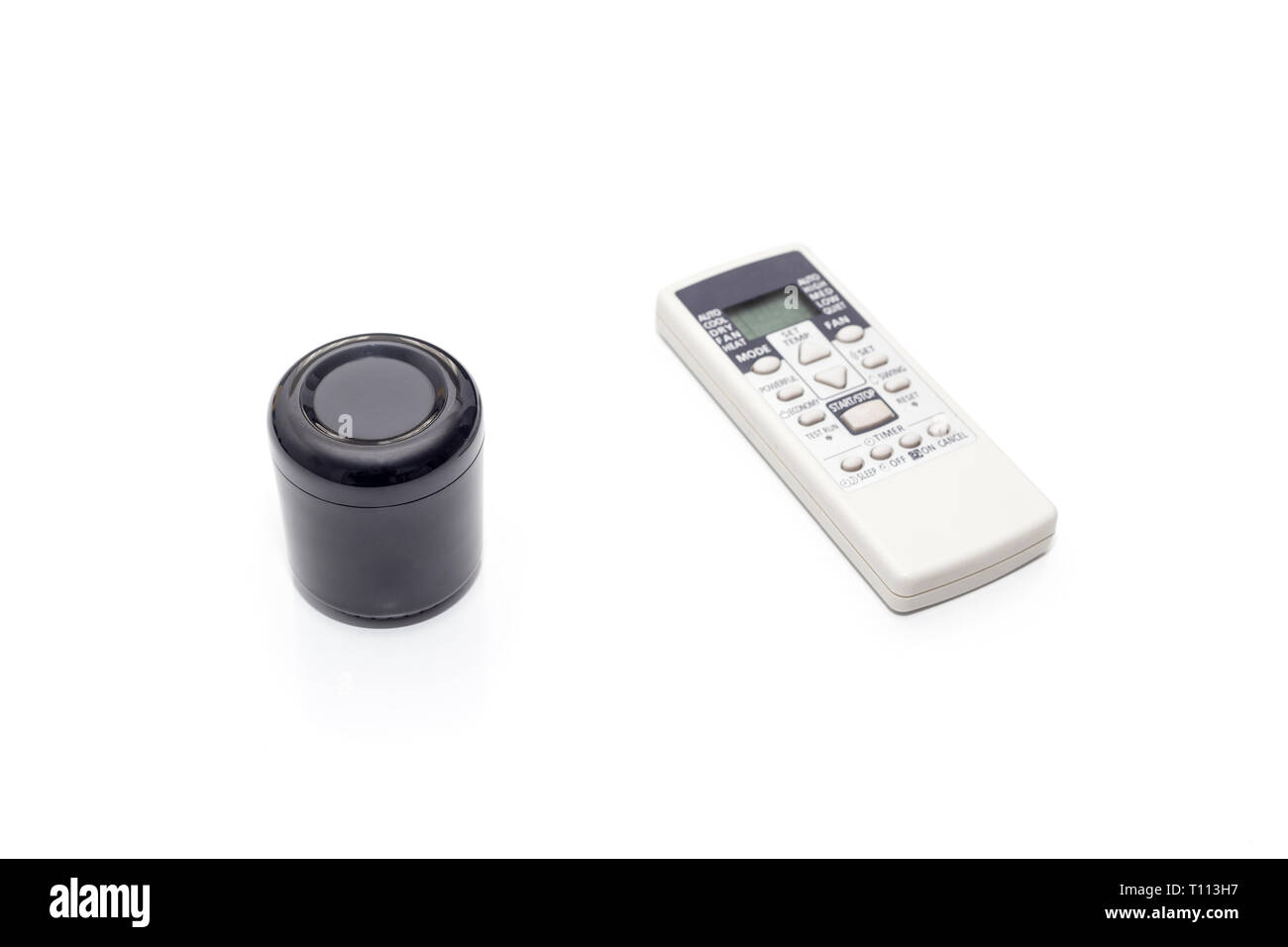 Universal ir and wifi remote with voice activation next to old ...