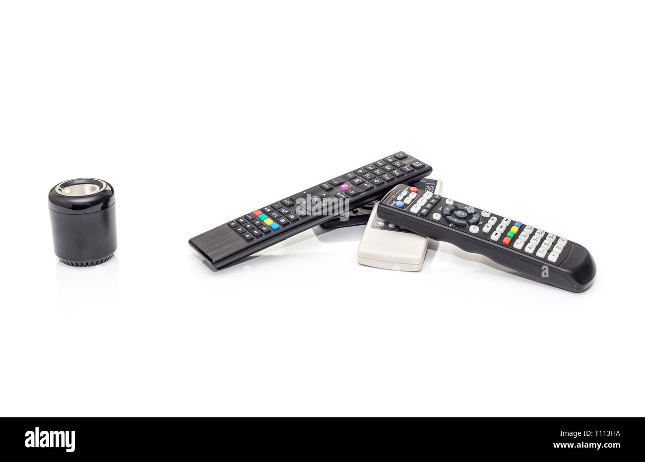 Universal ir and wifi remote with voice activation next to old ...