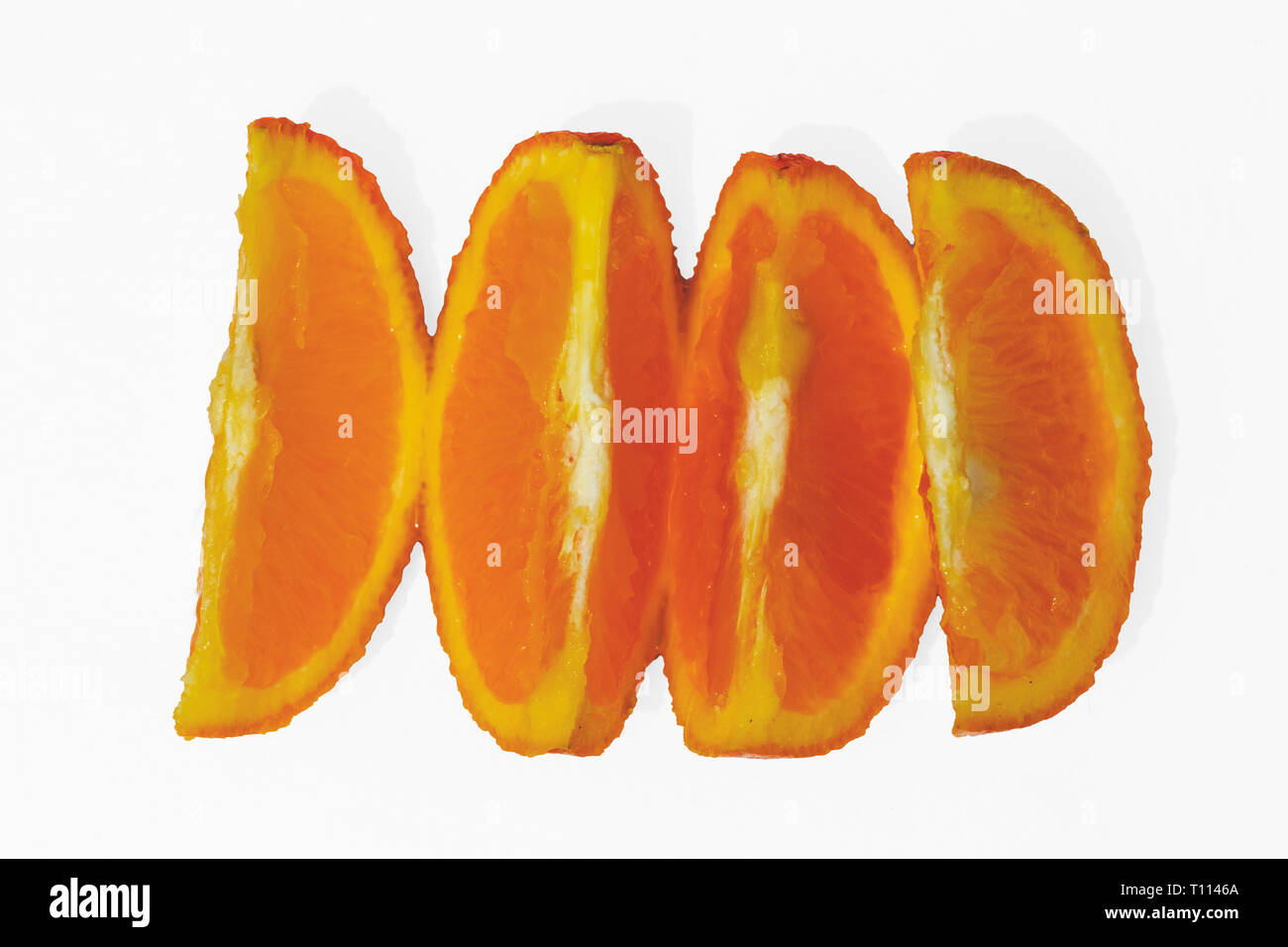 orange cut in different portions with white background Stock Photo - Alamy